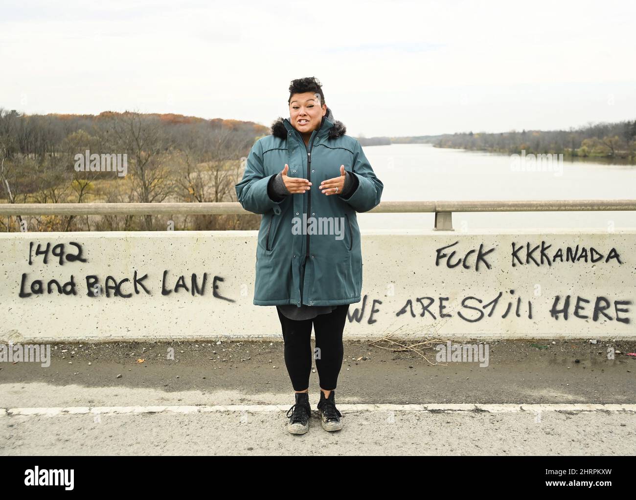 Kahsenniyo Williams reads a poem near the construction site at the ...