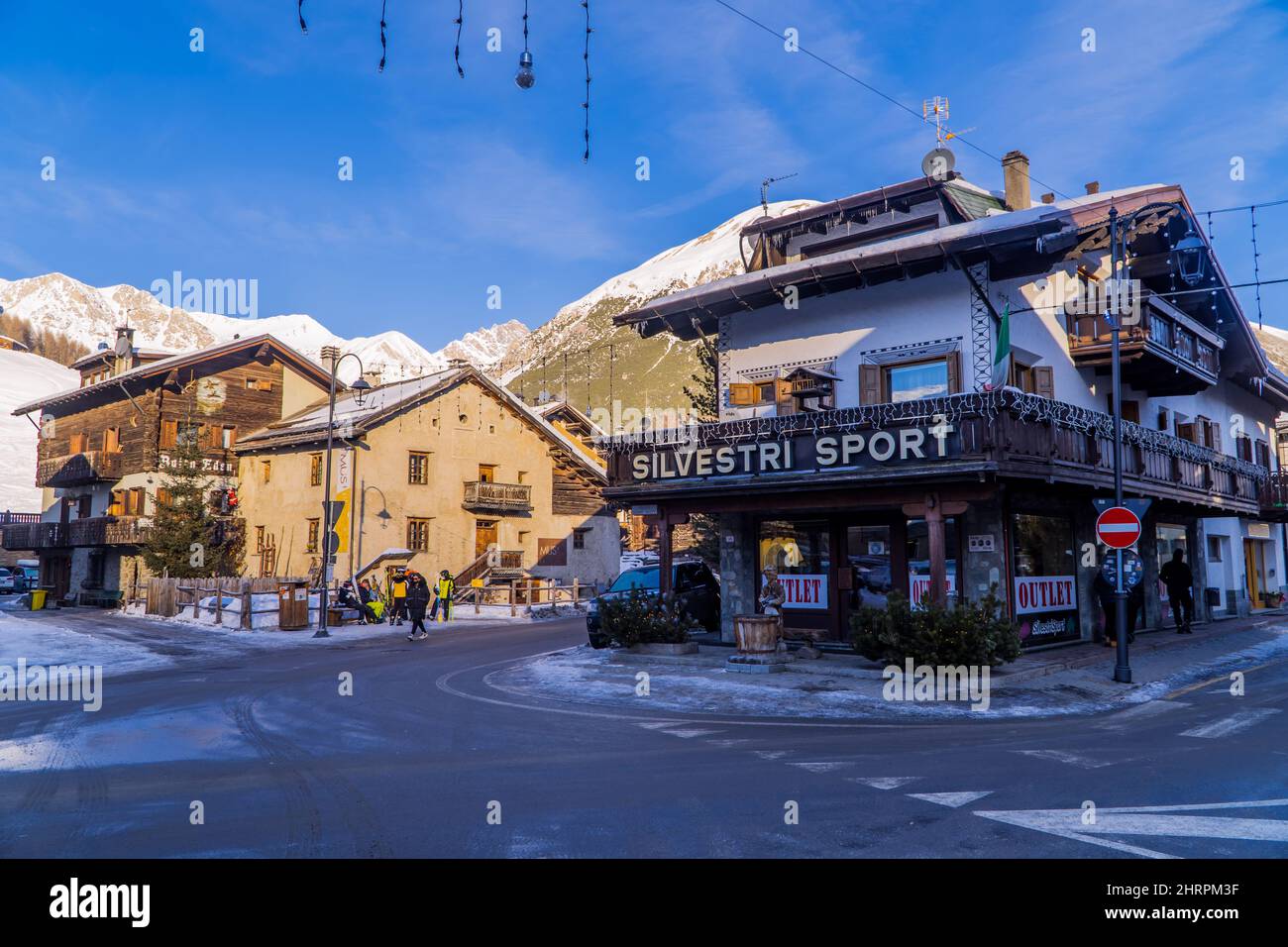 Traditional alpine houses with shops and people Stock Photo - Alamy