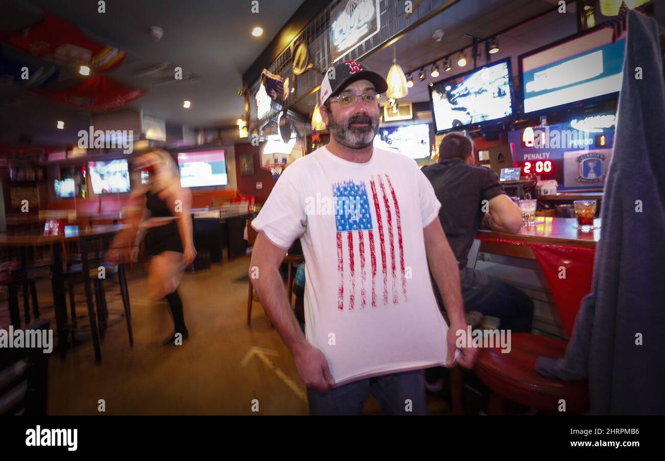 Patron Dave Dion proudly shows off his American flag t-shirt as he ...