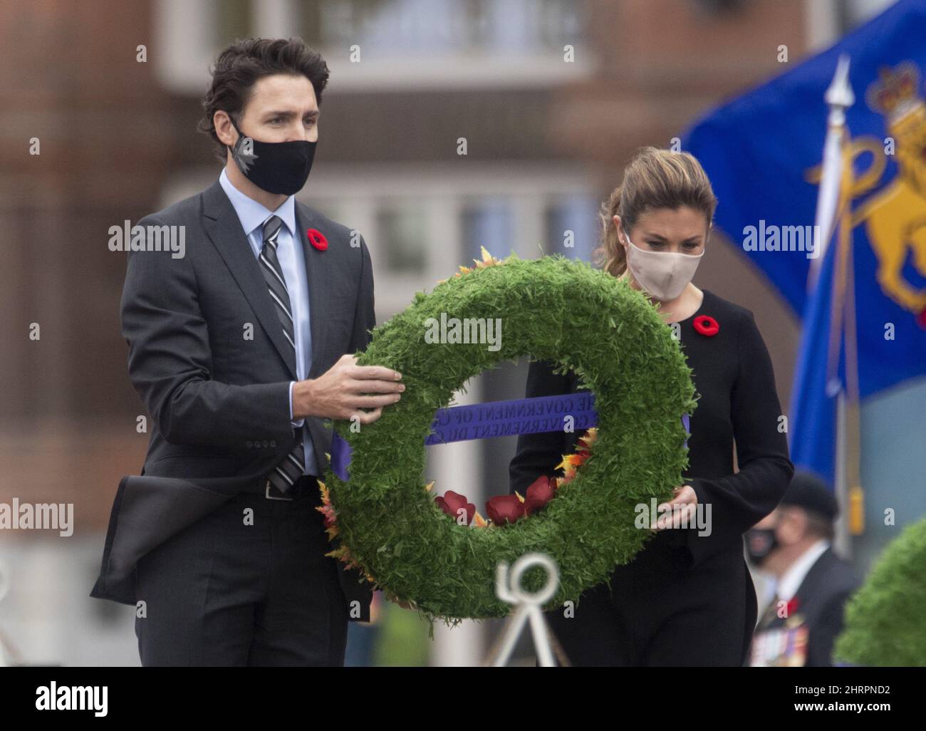 Prime Minister Justin Trudeau and his wife Sophie Gregoire Trudeau place a wreath during a ...