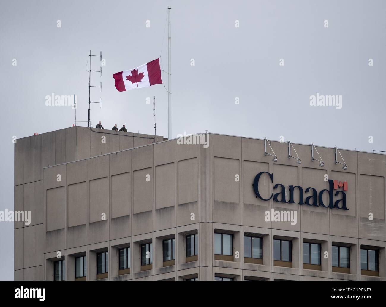 The Canadian flag flies at half mast over a National Defence building during a Remembrance Day ...