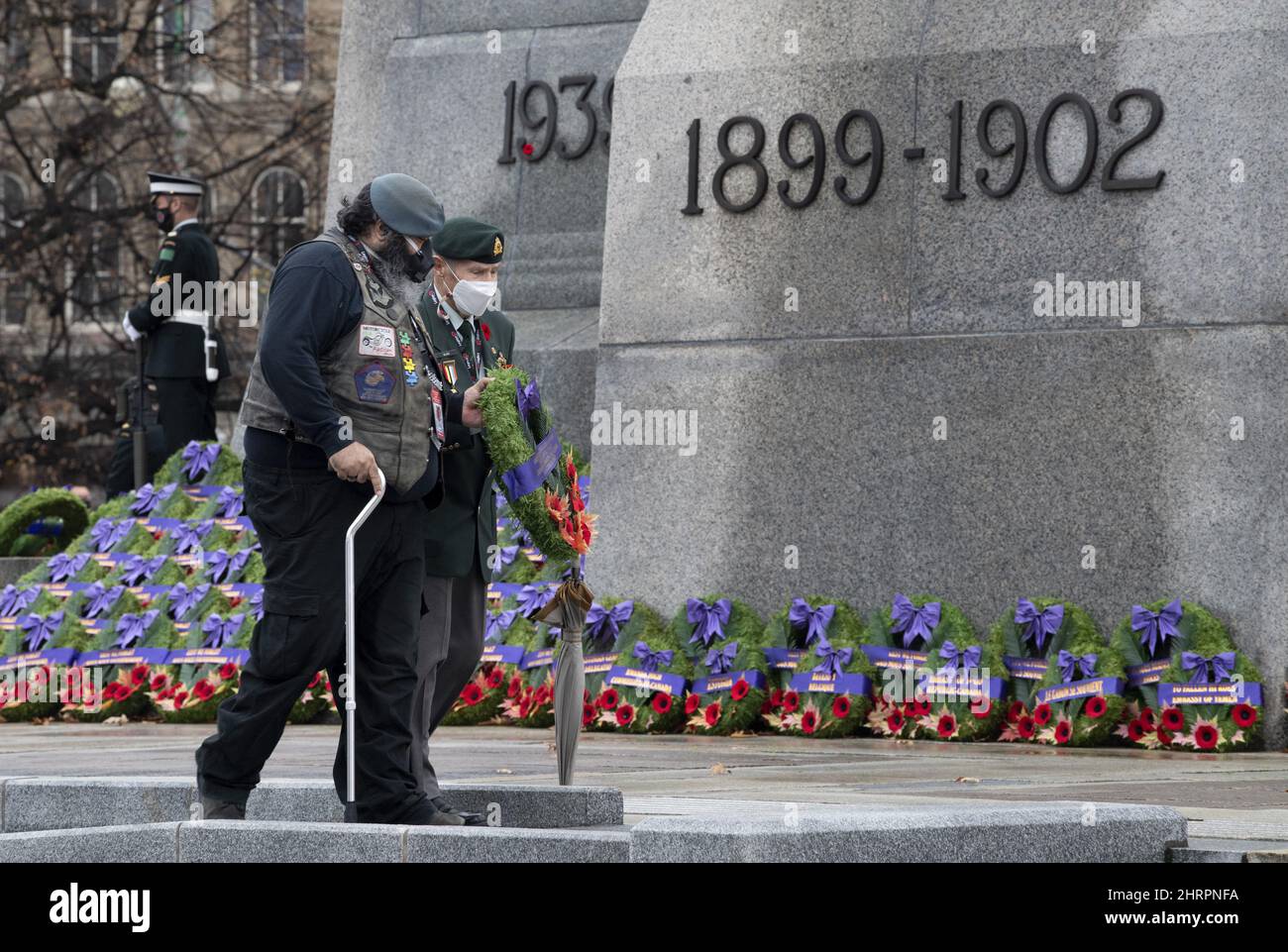 Veterans carry a wreath to place on the National War Memorial during a ...
