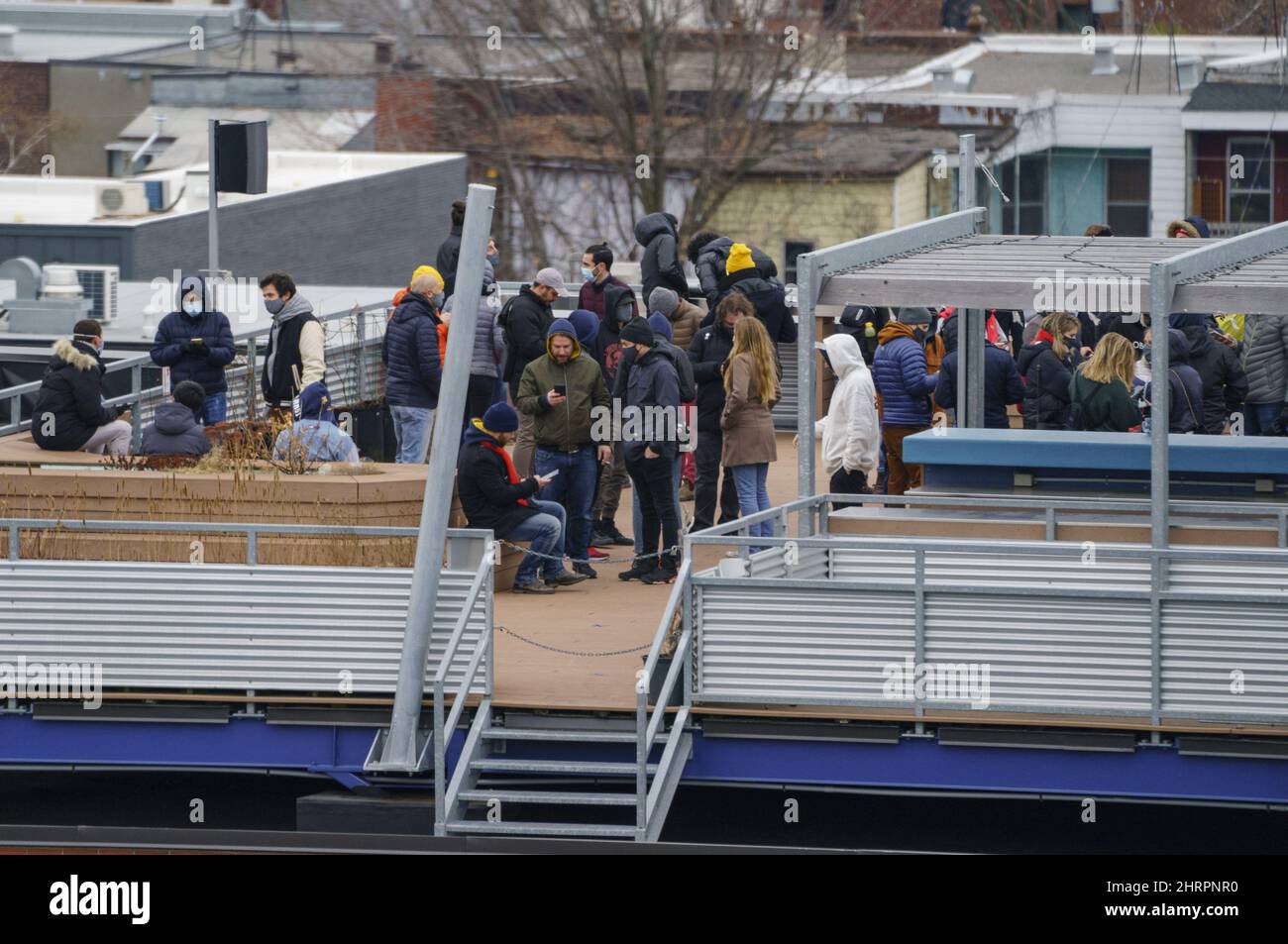People stand on the rooftop of the offices of Ubisoft during a police ...