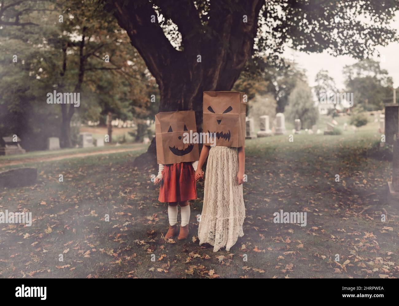 Girls wearing scary cardboard boxes on their heads Stock Photo - Alamy