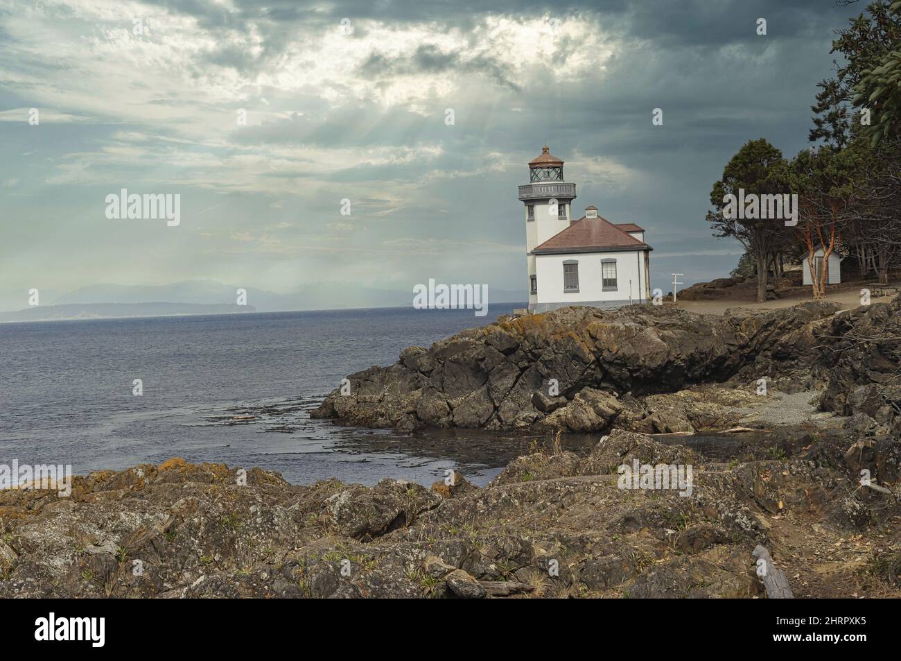 Beautiful view of the Lime Kiln Point State Park Lighthouse near water ...
