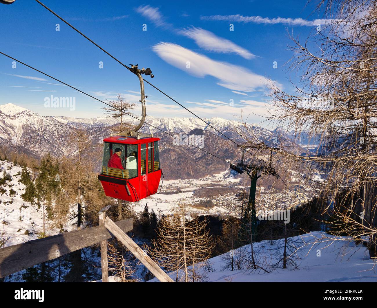 Red ropeway cabin with a background of snow-covered mountains Stock ...