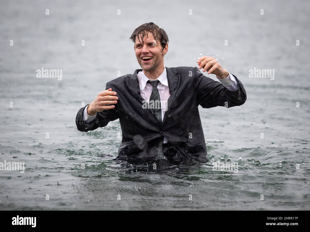 Jason Rude wears a suit and tie as he plunges into the water at English ...