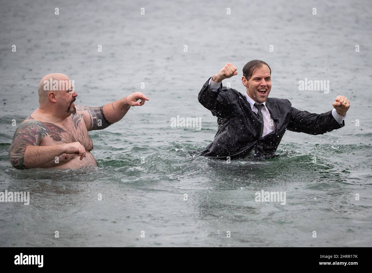Jason Rude, right, wears a suit and tie as he and his friend Brian Way ...