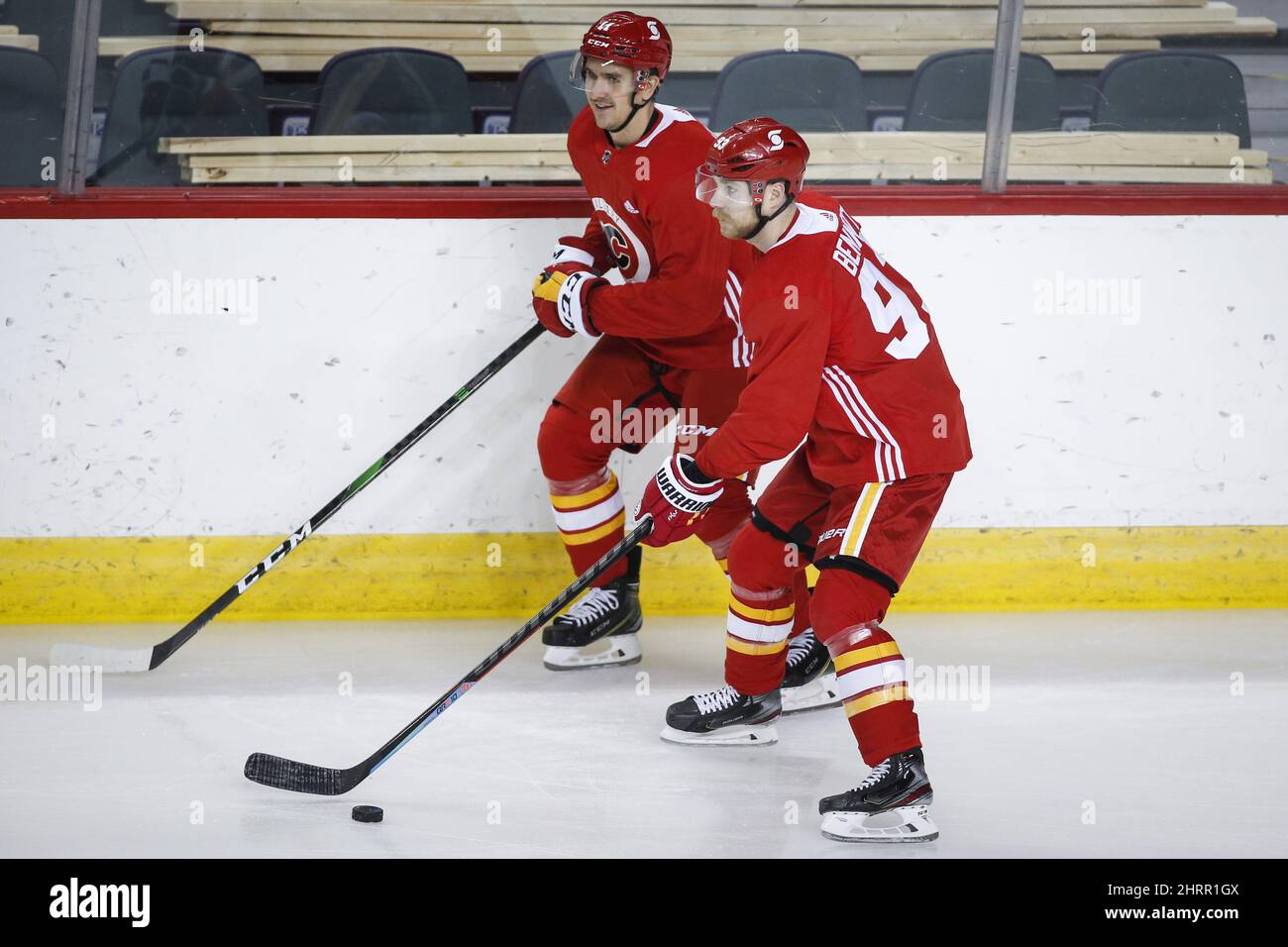 Calgary Flames' Sam Bennett, right, and Mikael Backlund skate during a ...