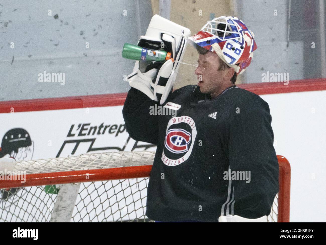 Montreal Canadiens goaltender Jake Allen sprays his face with water ...