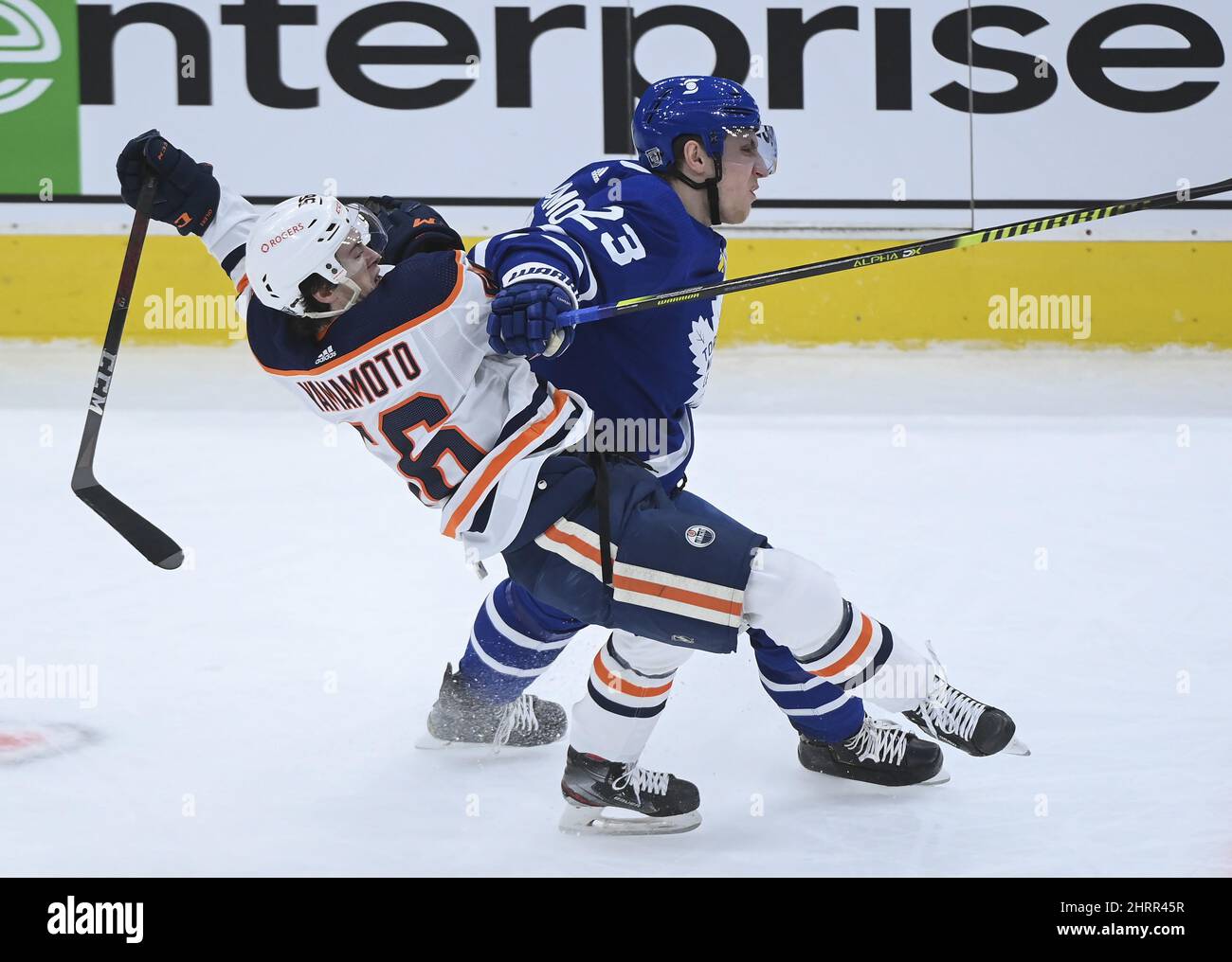 Toronto Maple Leafs defenceman Travis Dermott (23) hits Edmonton Oilers ...