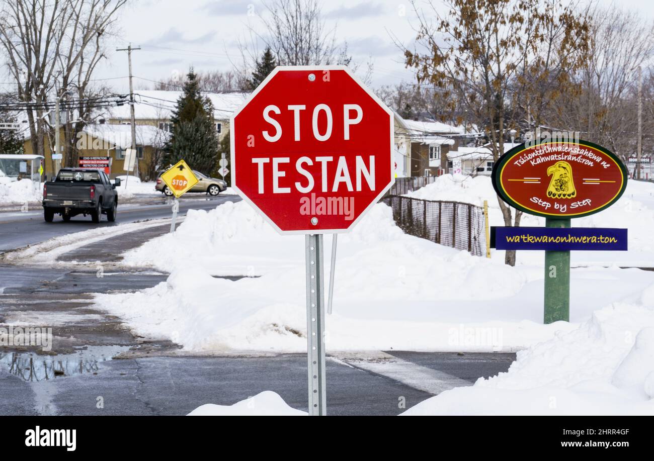 A stop sign written in English and in Mohawk is seen in Kahnawake, Que ...
