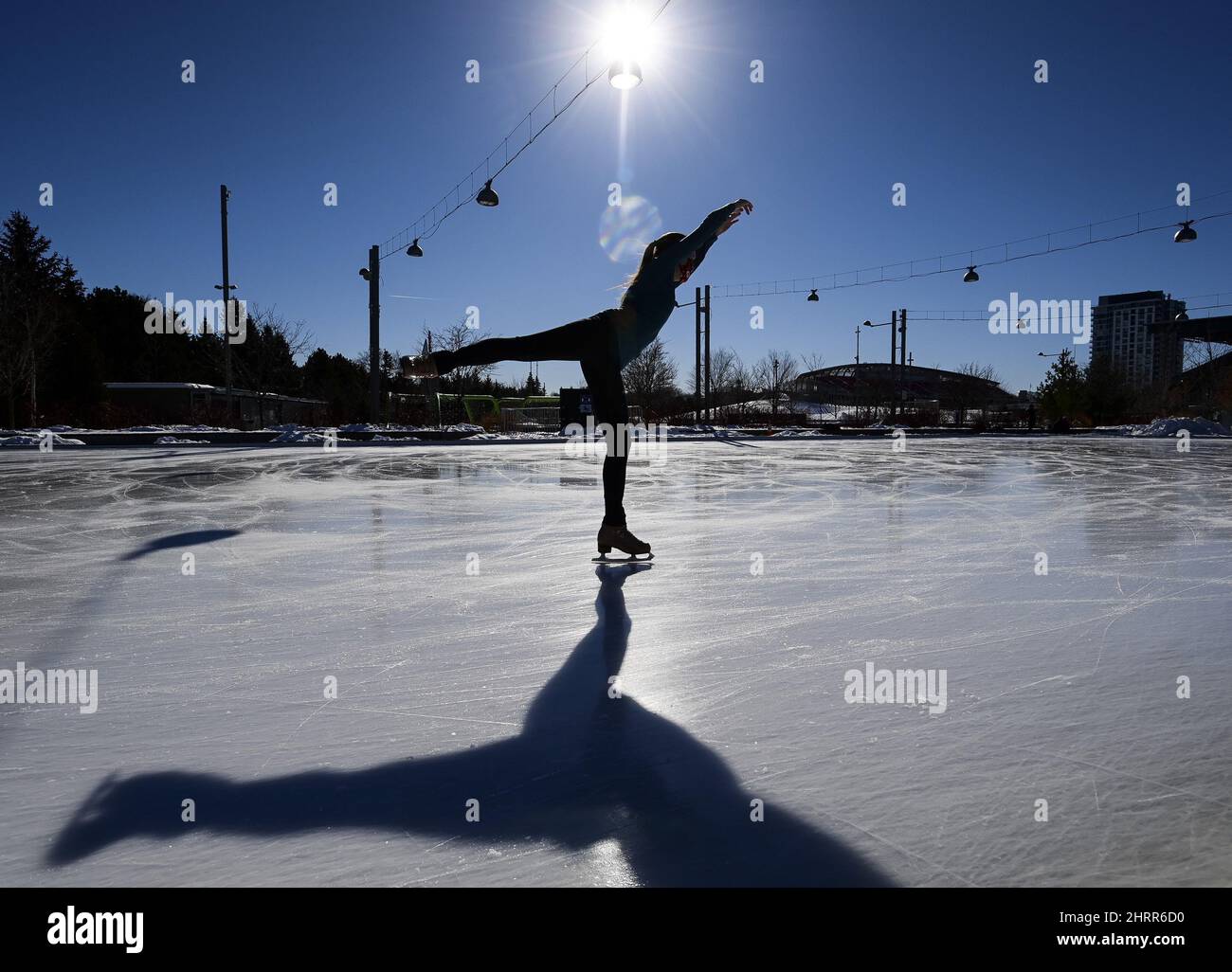 A figure skater takes advantage of a quiet pristine sheet of ice as she ...