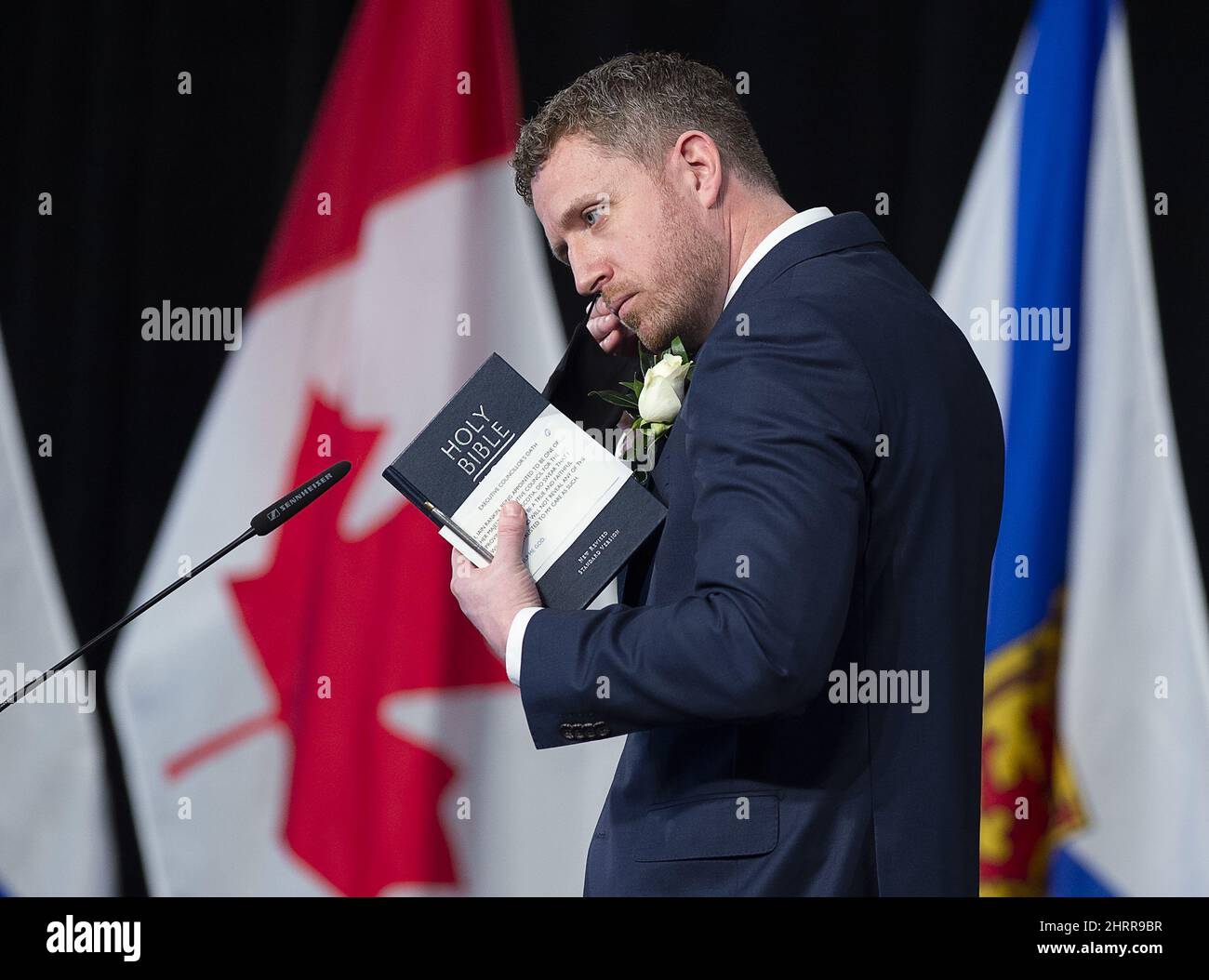 Nova Scotia Premier Iain Rankin adjusts his face mask after taking his ...
