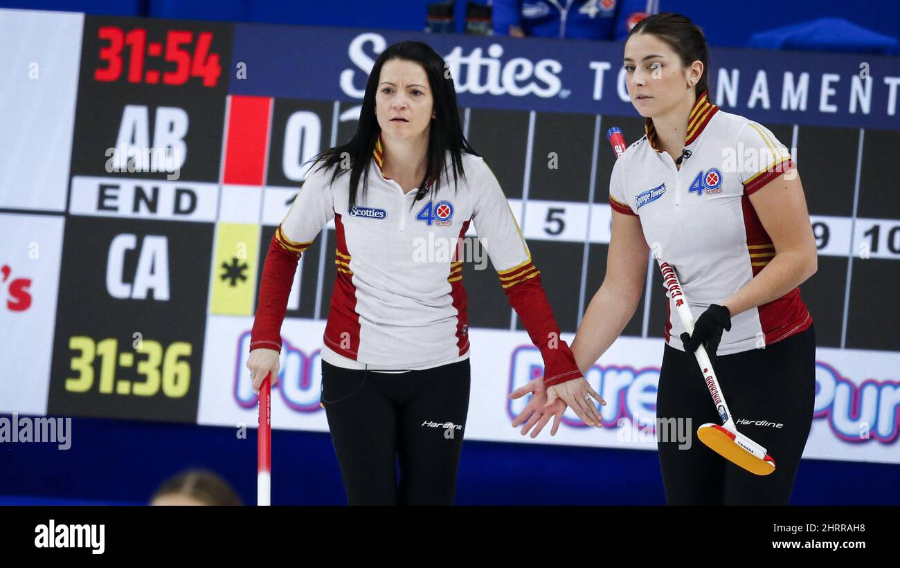 Team Canada skip Kerri Einarson, left, taps hands with second Shannon ...