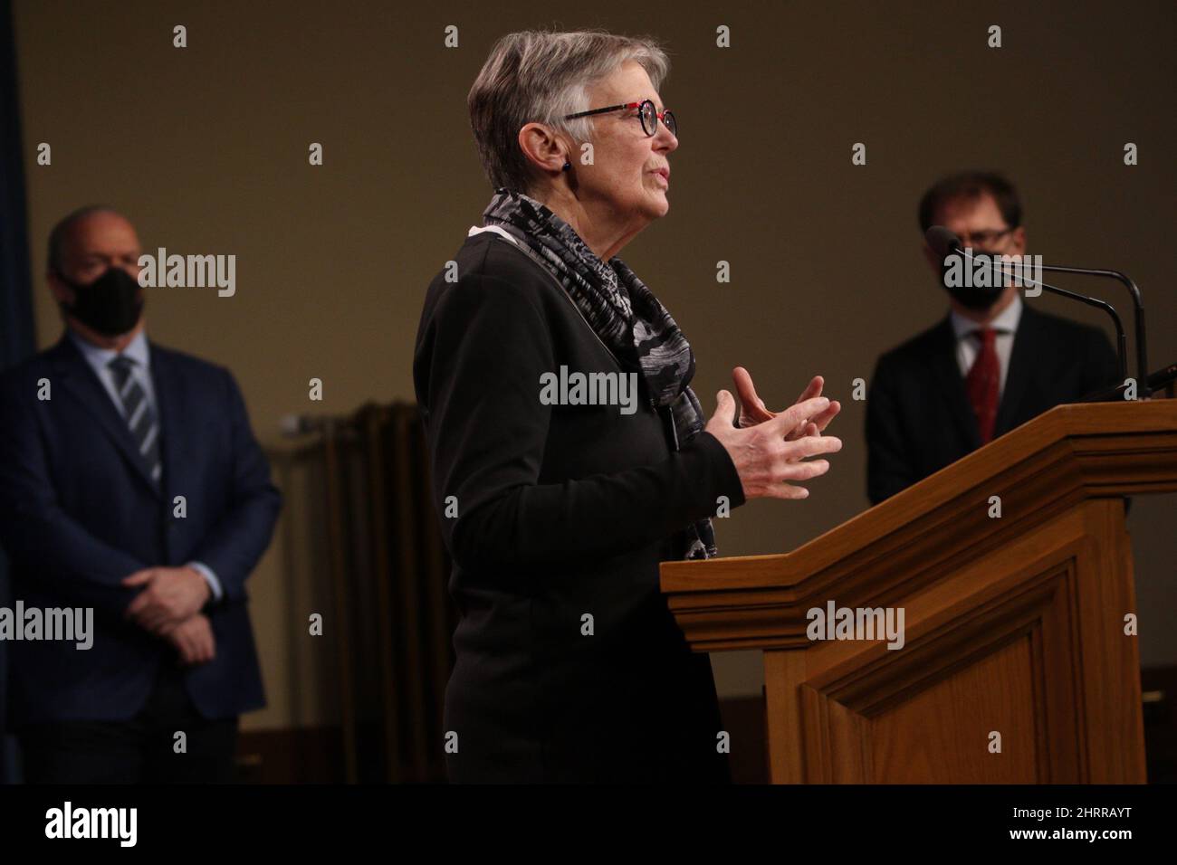 Premier John Horgan and Minister Adrian Dix look on as Dr. Penny Ballem ...