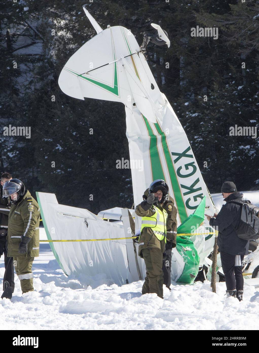Police investigate the scene where a small plane crashed into Lac ...