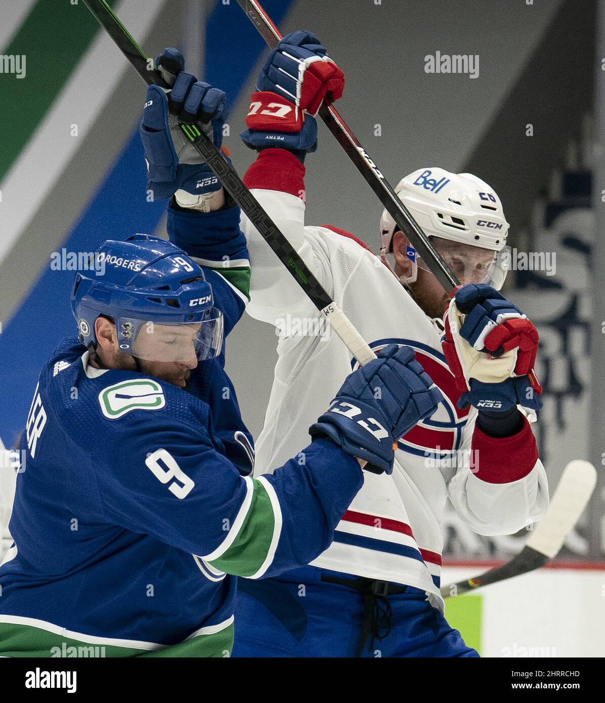 Vancouver Canucks centre J.T. Miller (9) fights for control of the puck ...
