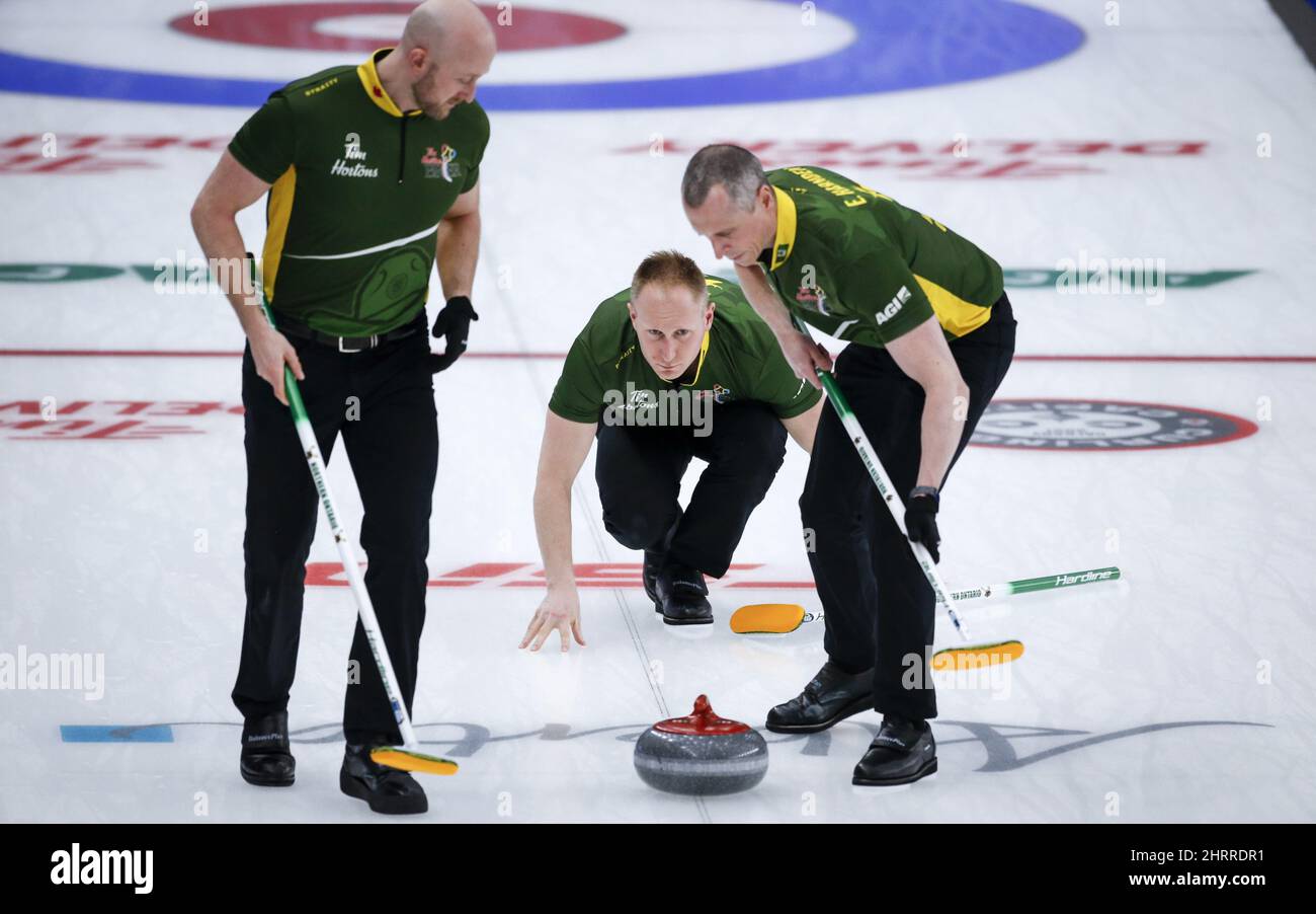 Team Northern Ontario skip Brad Jacobs, centre, makes a shot as lead ...