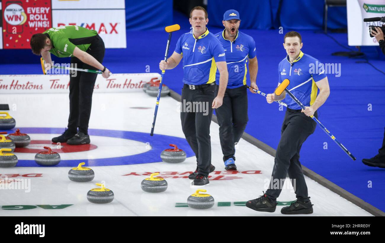 Team Alberta, left to right, lead Karrick Martin, third Darren Moulding ...