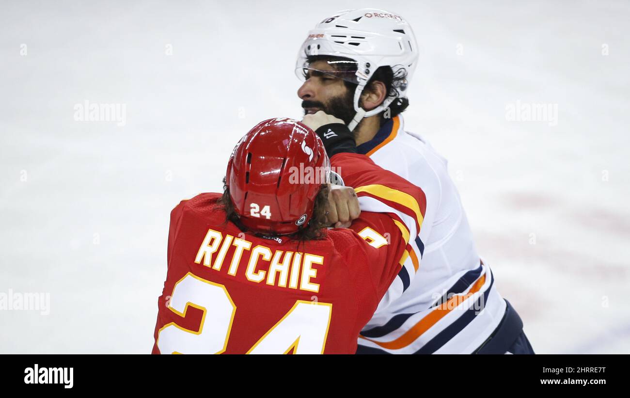 Edmonton Oilers' Jujhar Khaira, right, takes punch on the chin while ...