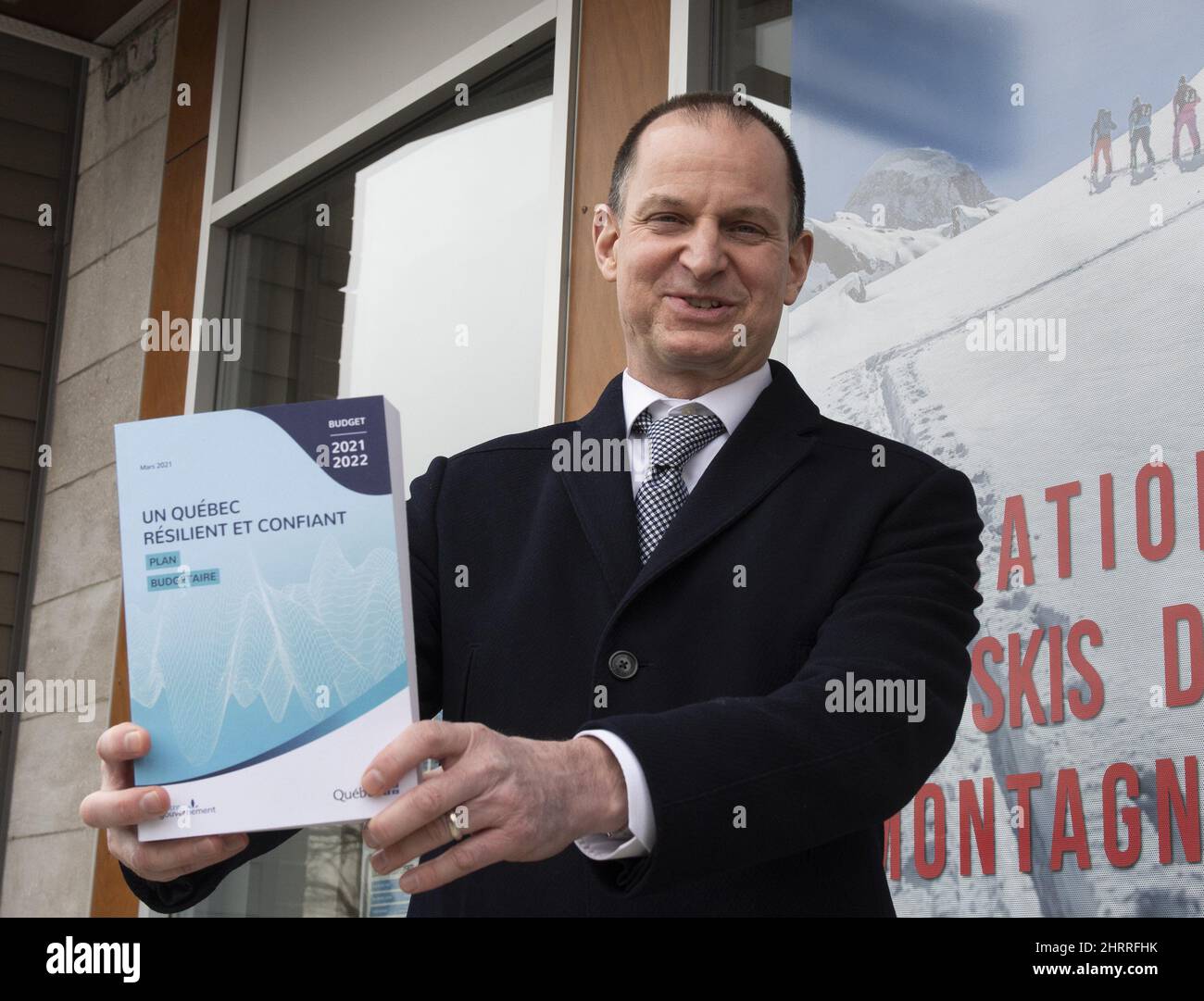 Quebec Finance Minister Eric Girard displays his budget speech outside ...