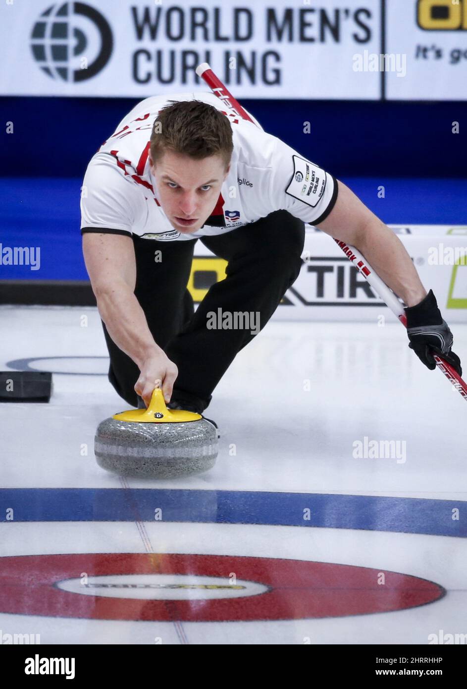 Denmark vice-skip Mikkel Krause makes a shot as he plays Team Canada at ...