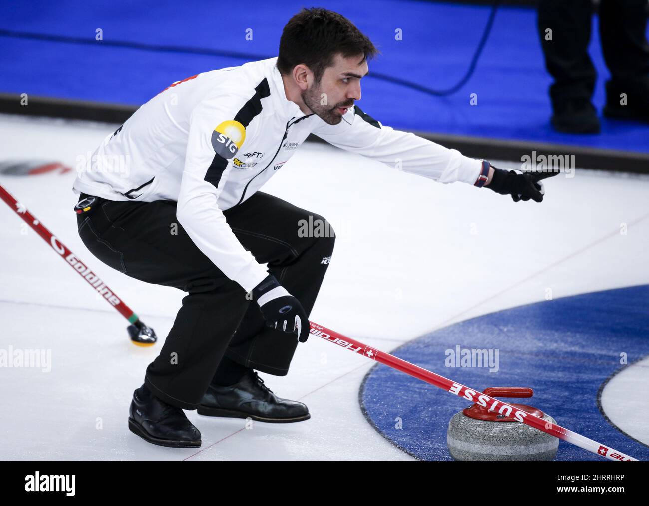 Switzerland skip Peter De Cruz directs his teammates against Team ...