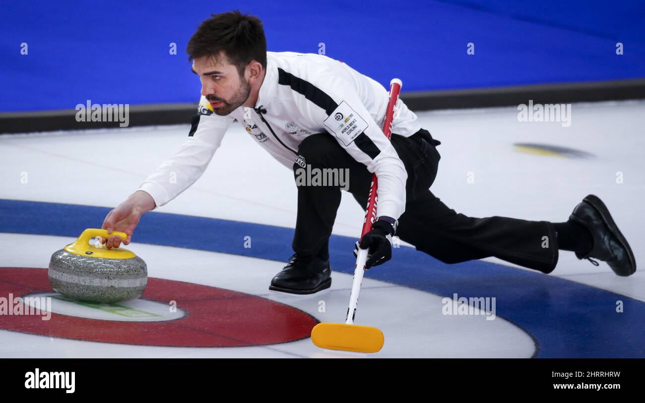 Switzerland skip Peter De Cruz makes a shot against Team Canada at the ...