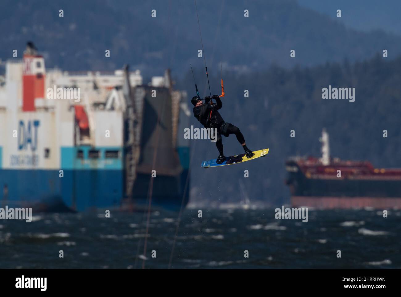 Sean Ward gets airborne as he kiteboards on English Bay in Vancouver ...