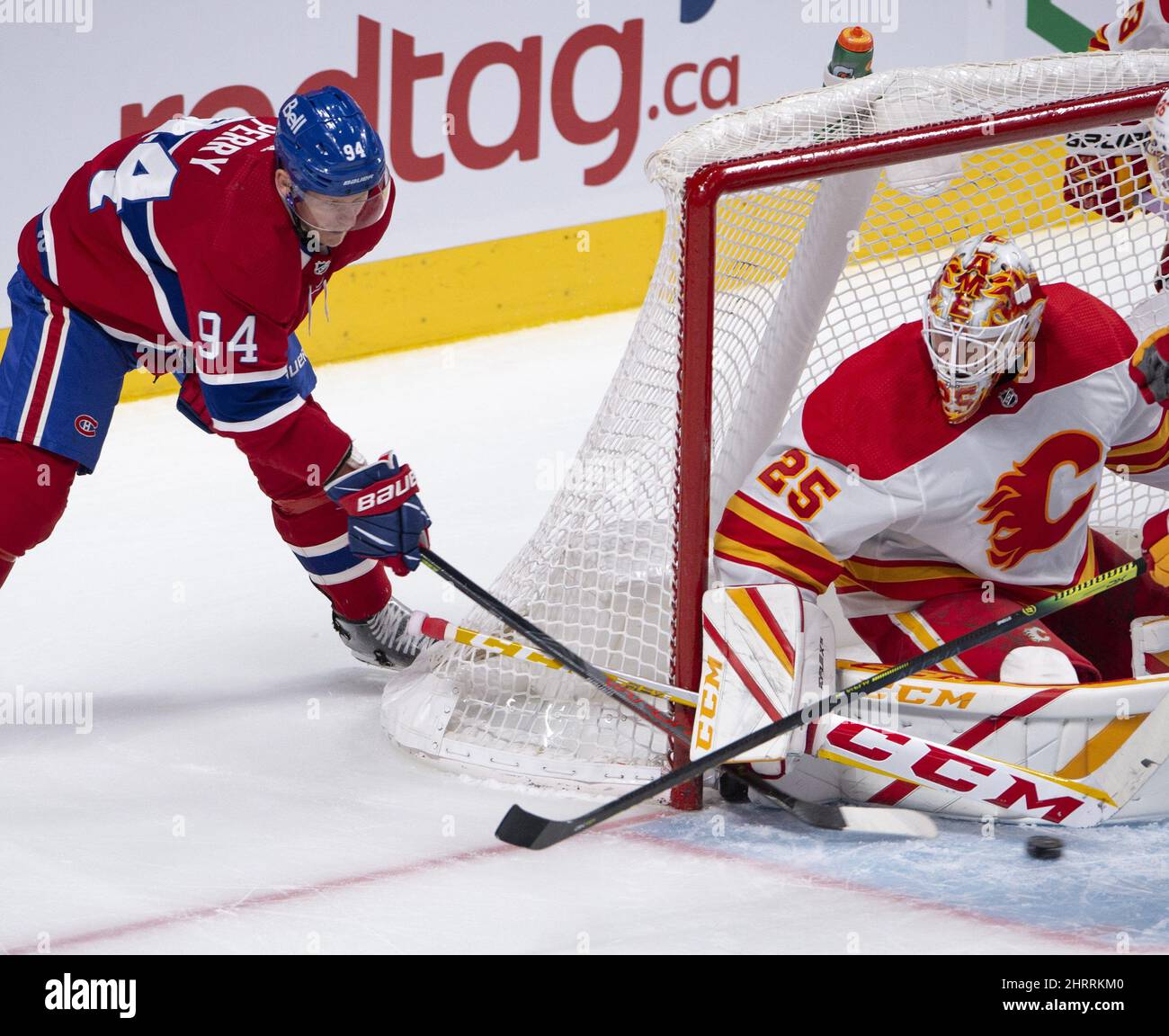 Calgary Flames goaltender Jacob Markstrom (25) stops Montreal Canadiens' Corey Perry (94) on a ...