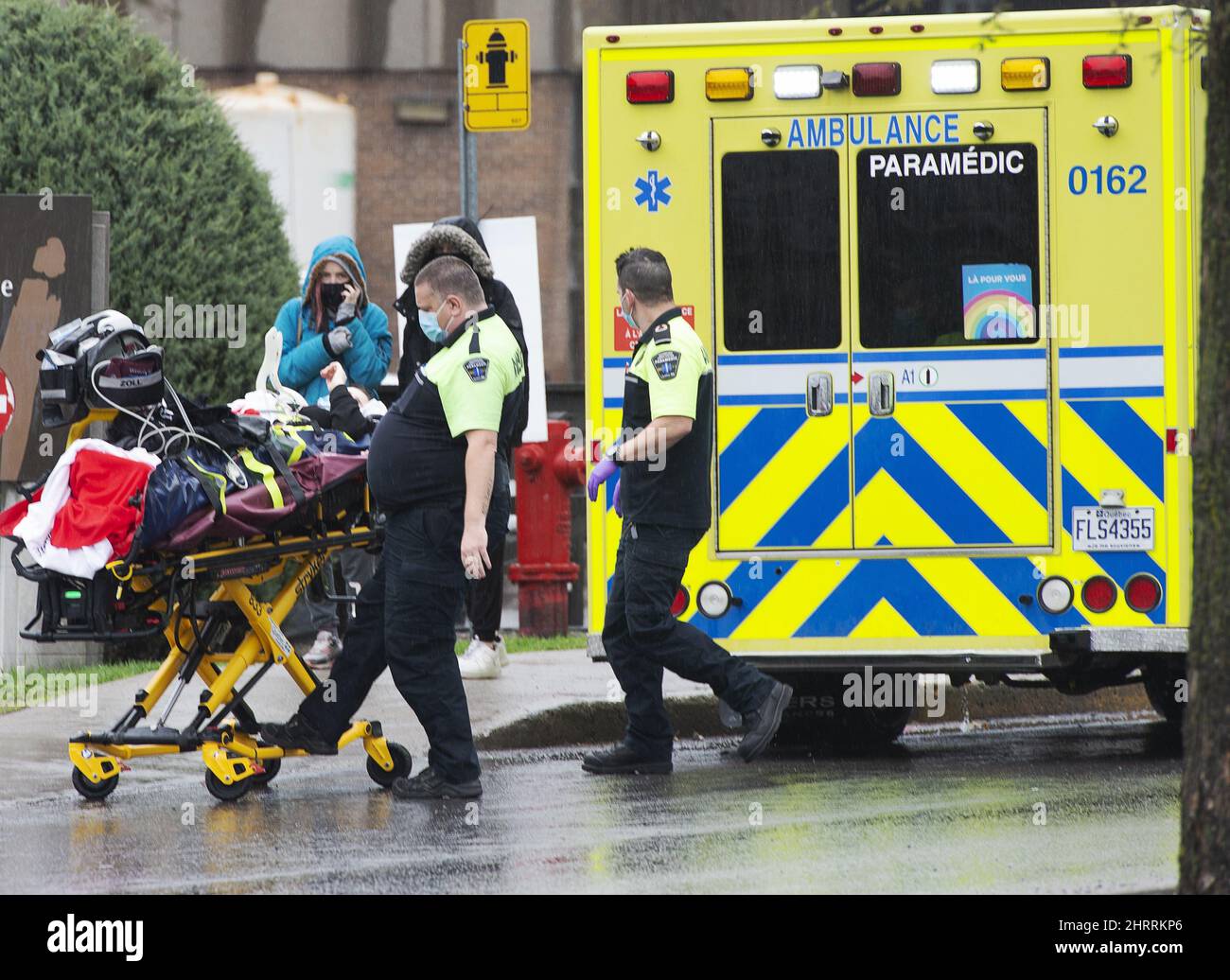 Ambulance workers transport a patient to the emergency ward at Verdun ...