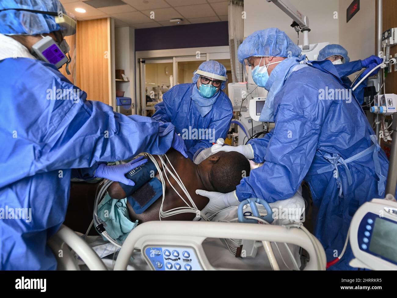 A 60-year-old COVID-19 patient fights for his life, desperately gasping ...