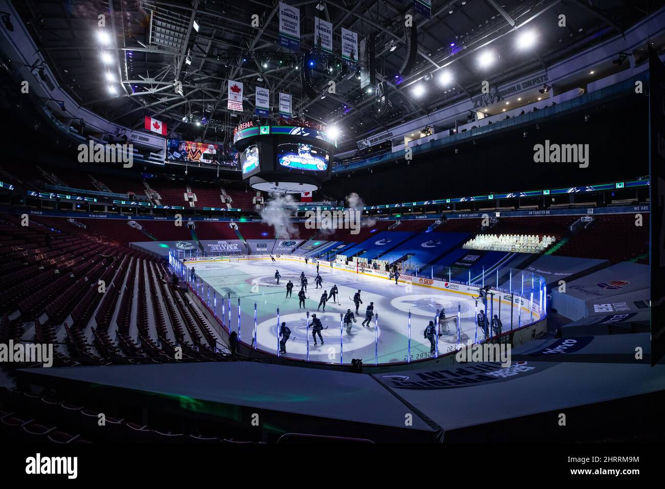Vancouver Canucks players skate on the ice before an NHL hockey game ...