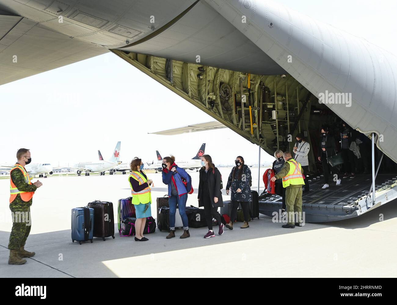Physician Dr. Allison Furey, third right, the wife of Newfoundland and ...