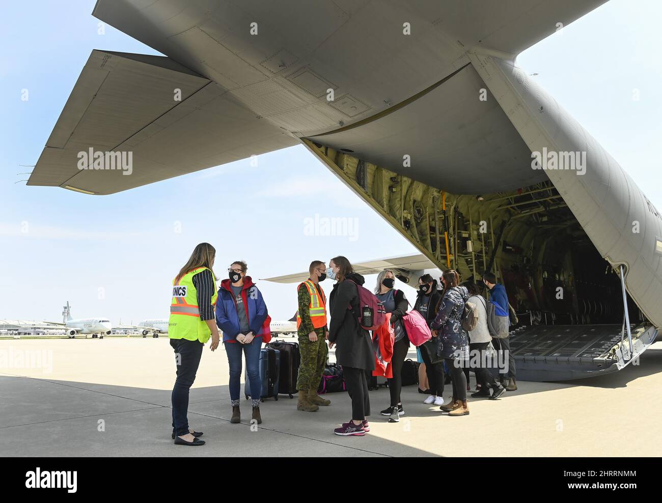 Physician Dr. Allison Furey, second right, the wife of Newfoundland and ...