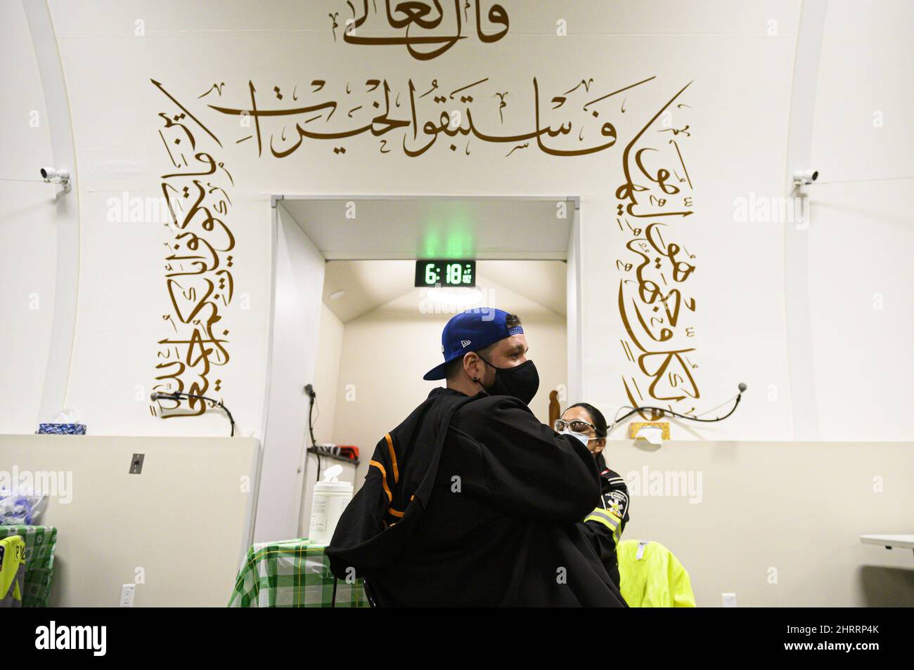 Peel Region Paramedic Maleeha Ghani, administers a dose of the Moderna ...