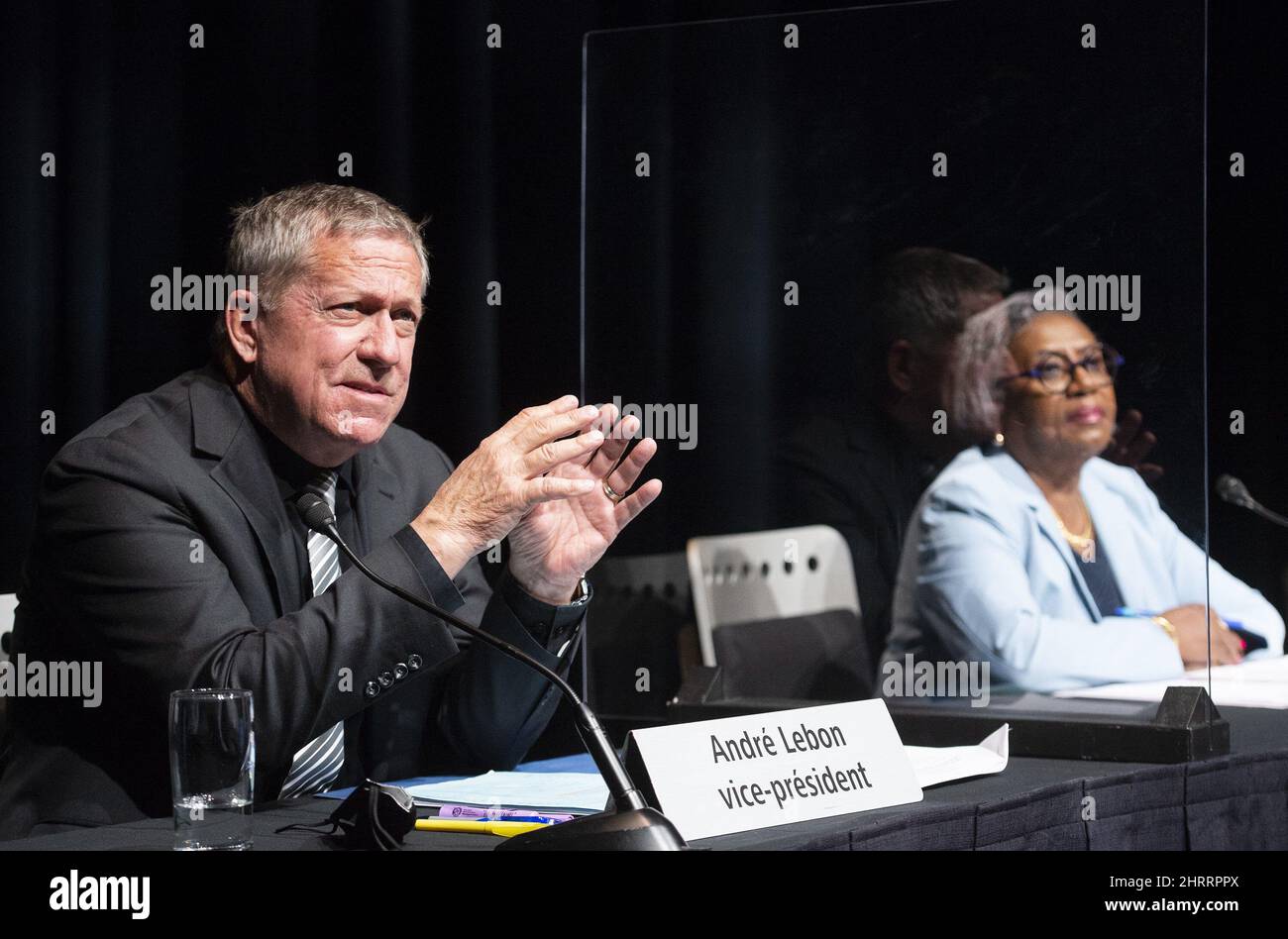 Regine Laurent, President of the Laurent Commission, right, looks on as ...