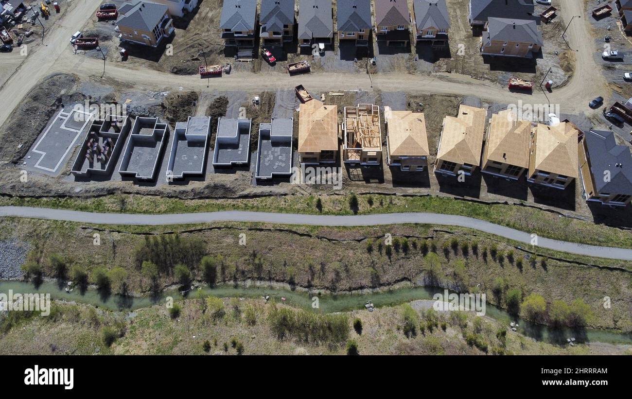 New homes are built in a housing construction development in the west ...