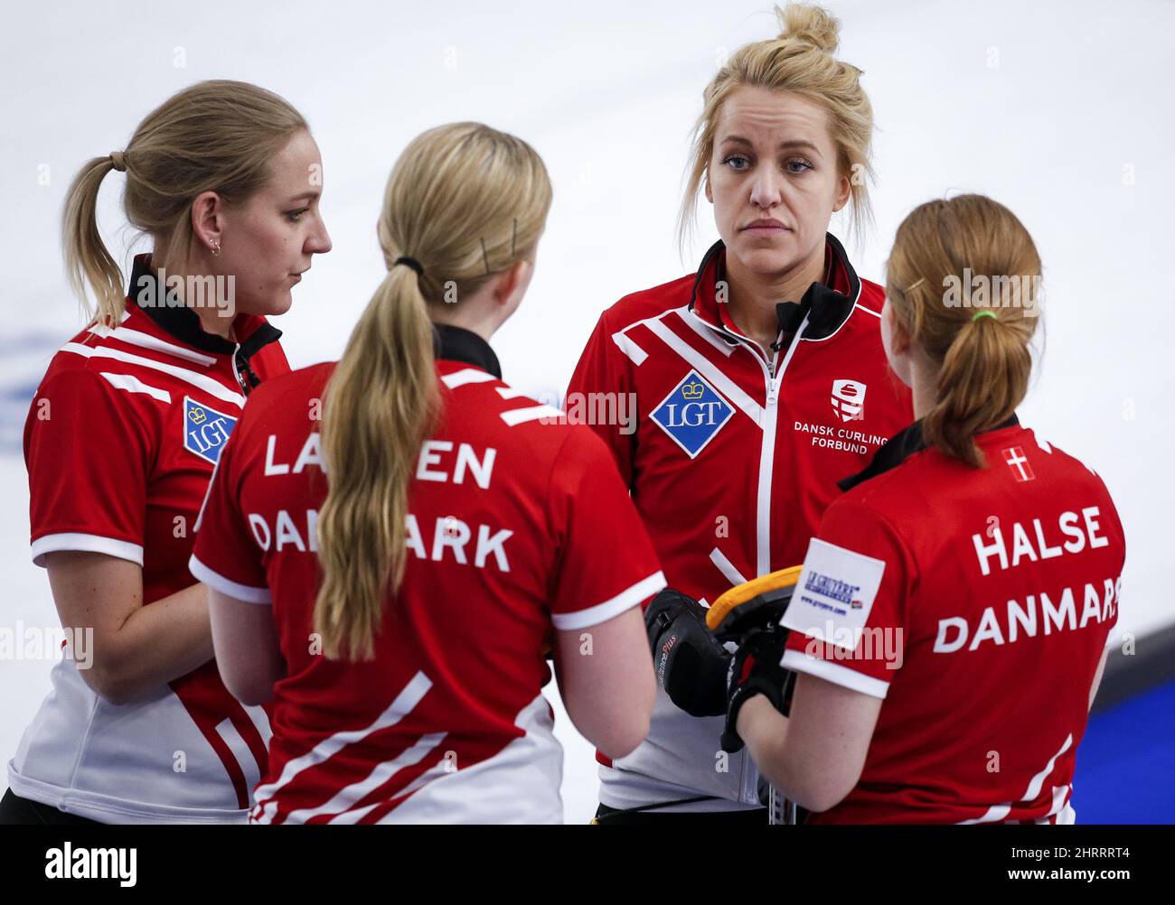 Denmark skip Madeleine Dupont, second right, speaks with her teammates ...