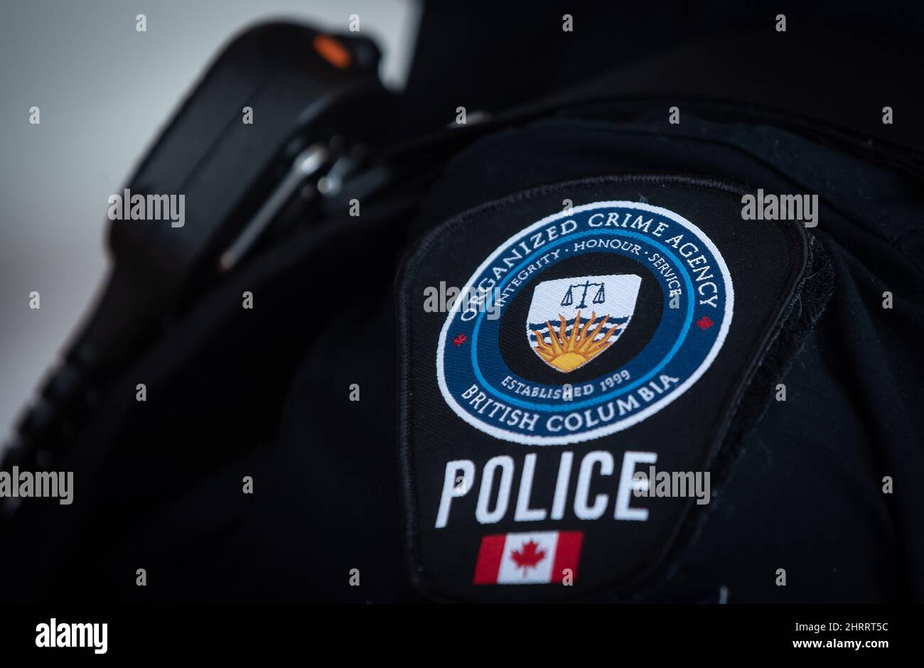 An organized crime agency police patch is seen on the shoulder of a ...