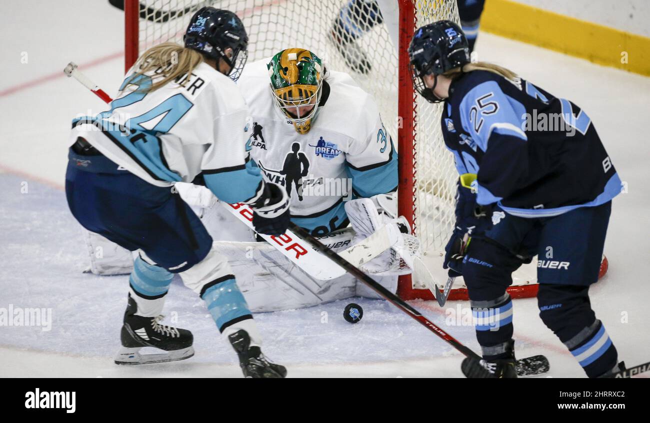 Team Bauer Jaime Bourbonnais, right, tries to get the puck past Team ...