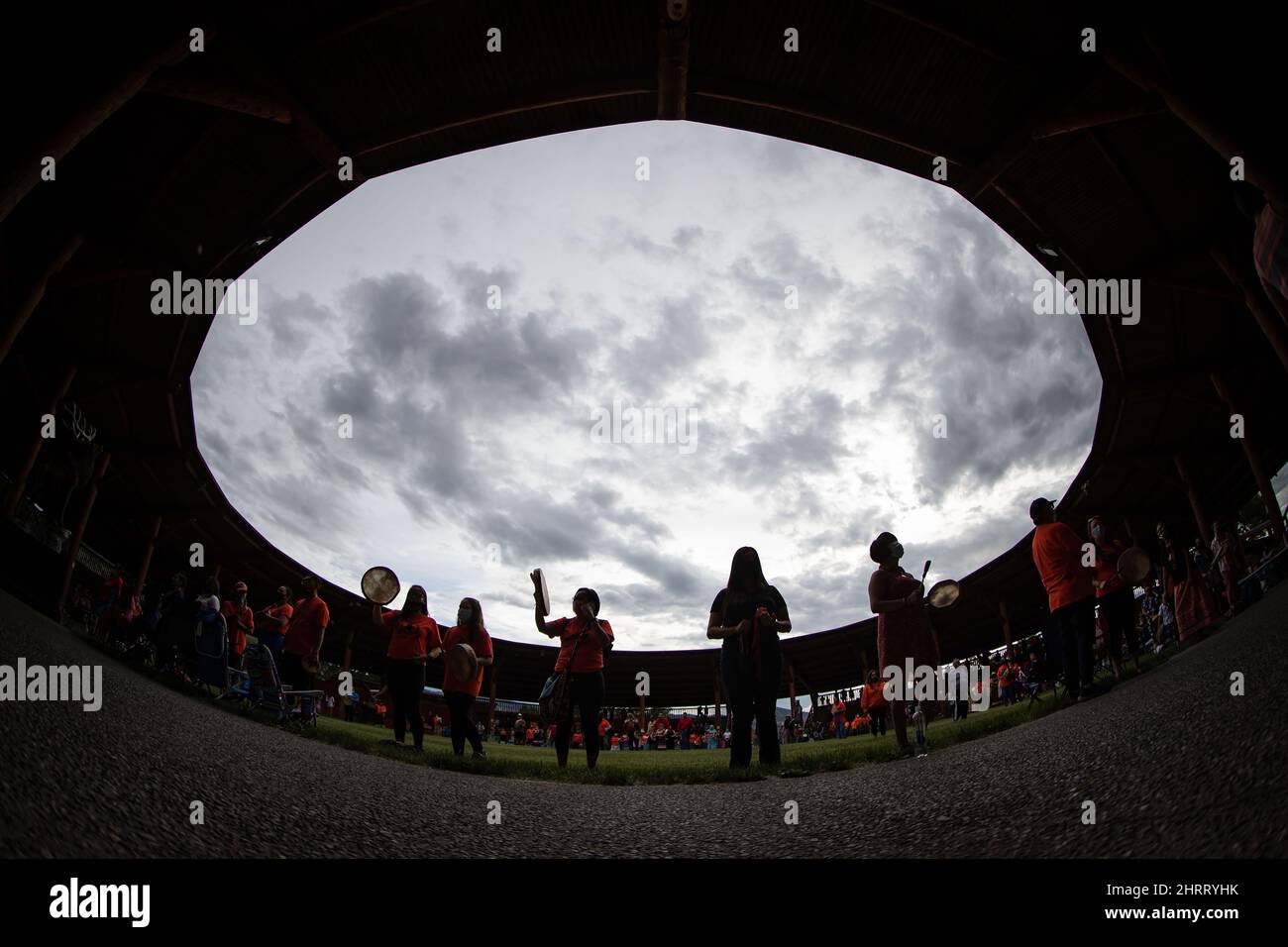 First Nations people sing and drum during a ceremony near the former ...