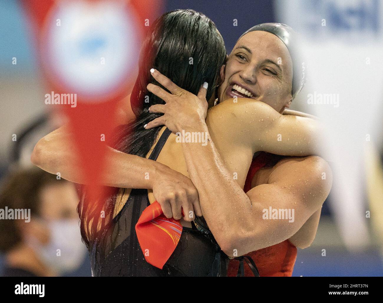 Kayla Sanchez, left, is hugged by Kylie Masse after winning the Womenâ ...