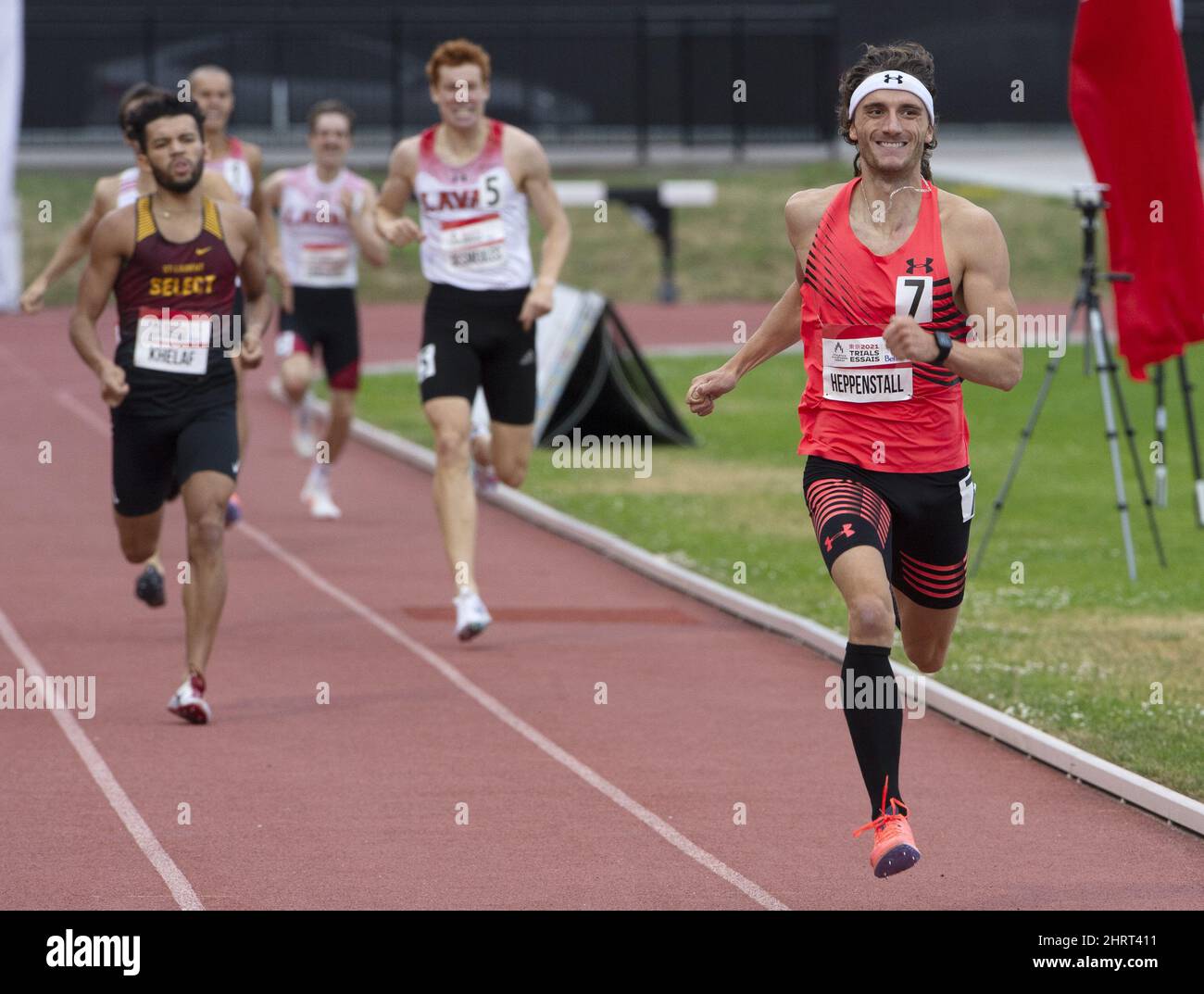 Robert Heppenstall, right, smiles as he leads the pack to the finish ...