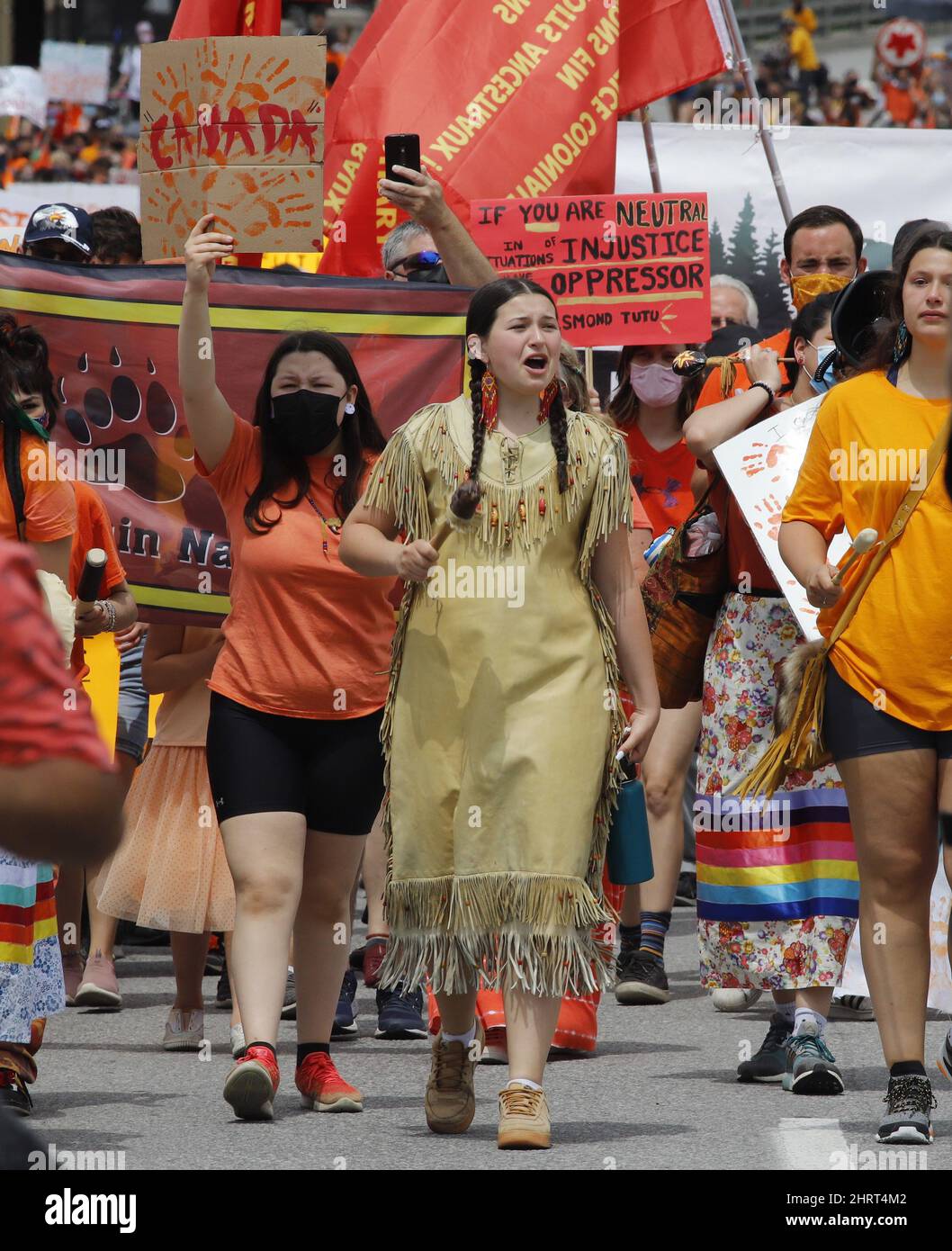 Protesters march to Parliament Hill in Ottawa at a "Cancel Canada Day ...