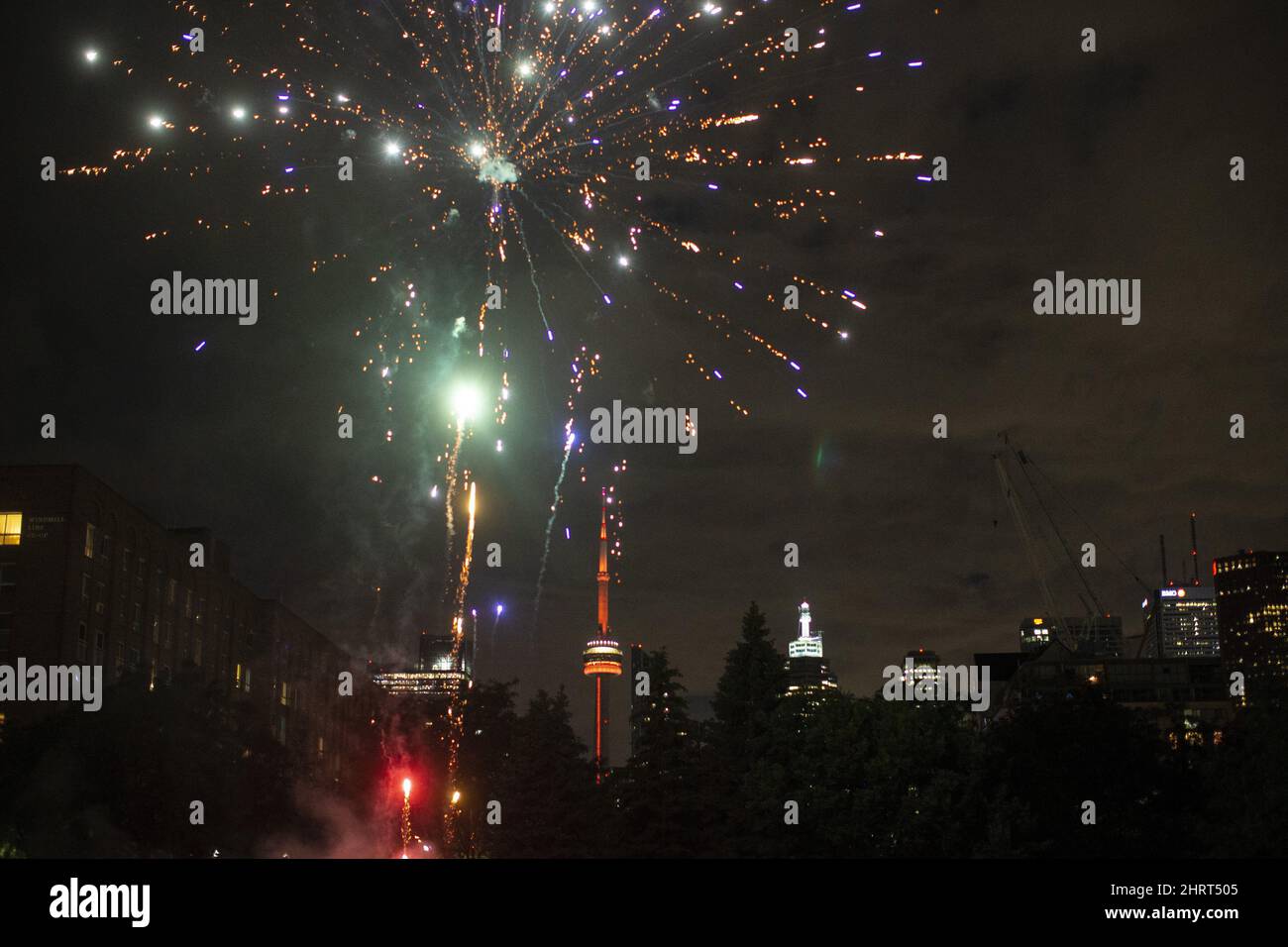 A neighbourhood Canada Day fireworks display is seen in a Toronto park ...