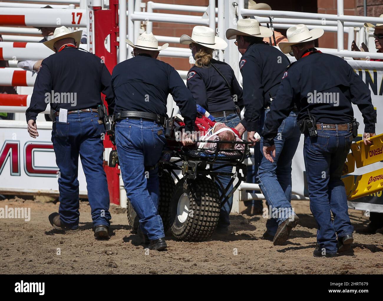 Bull rider Cole Fischer, of Jefferson City, Mo., is stretchered off the ...