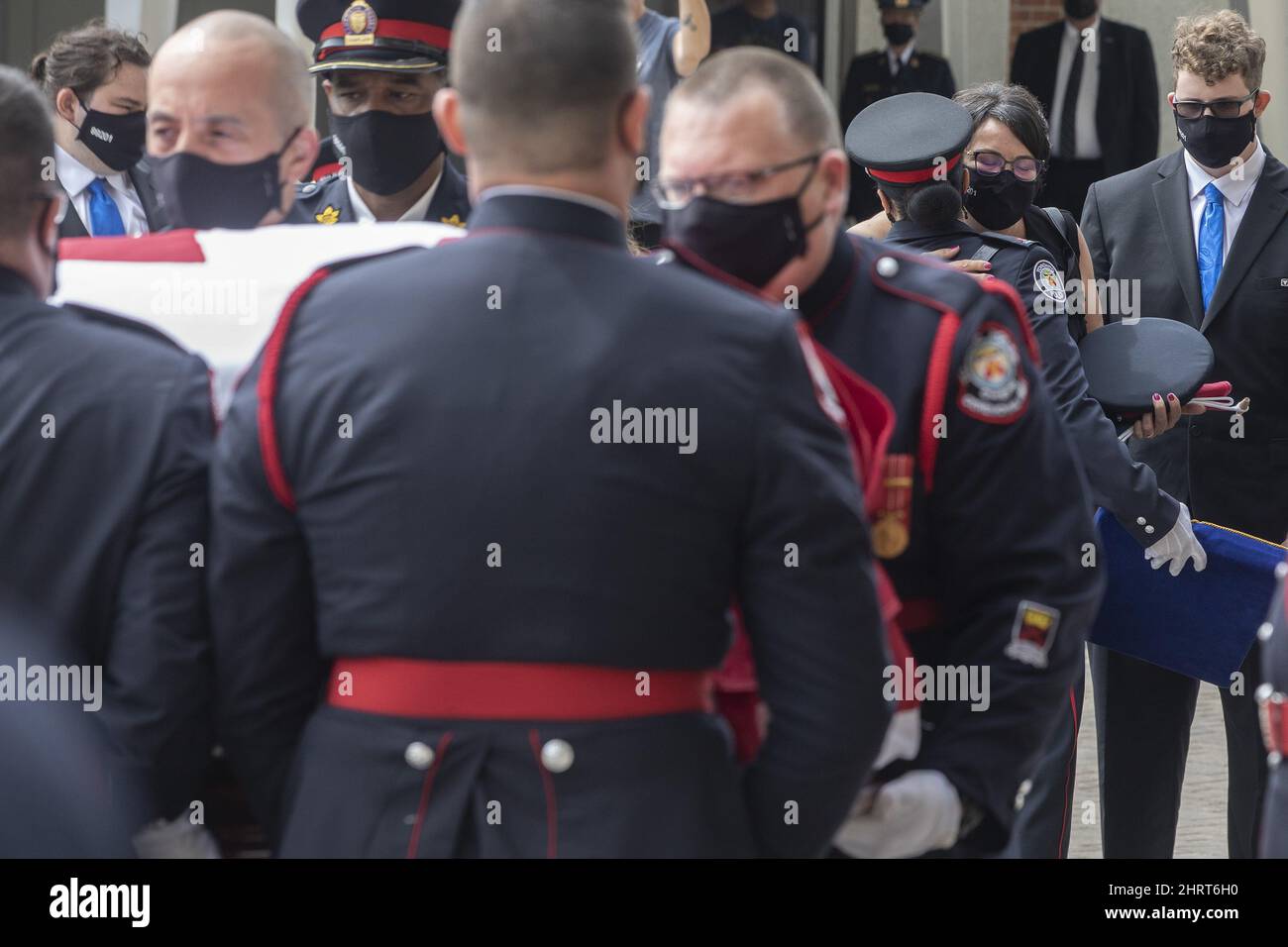 Margaret Northrup (second right) is comforted after being presented his ...