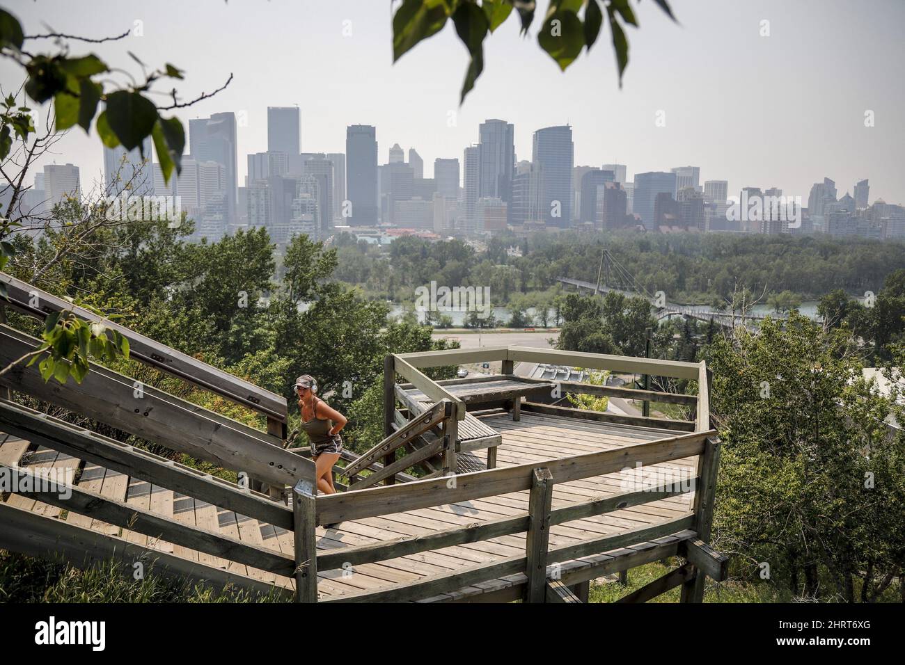 A haze of wildfire smoke from B.C. hangs over the downtown as woman ...